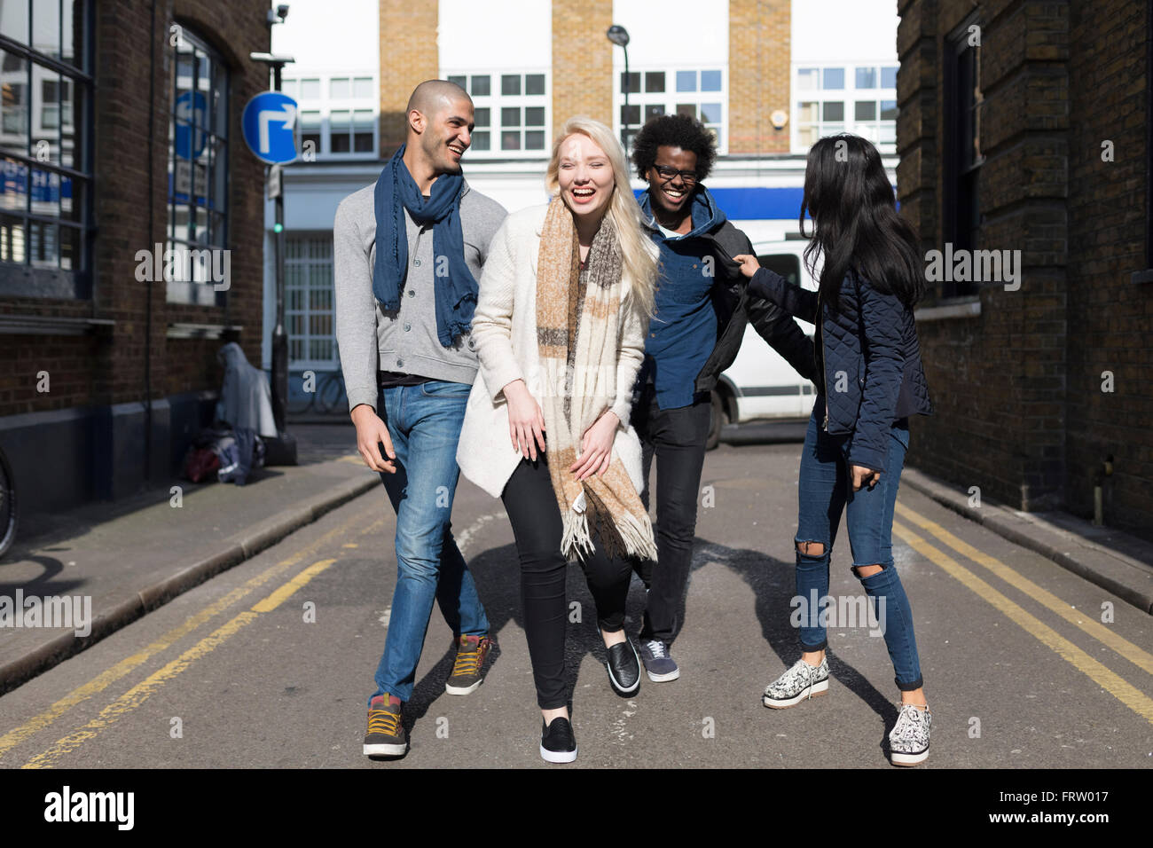 Group of friends having fun on urban street Stock Photo - Alamy