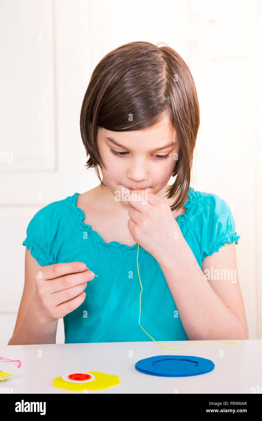 Girl embroidering hi-res stock photography and images - Alamy