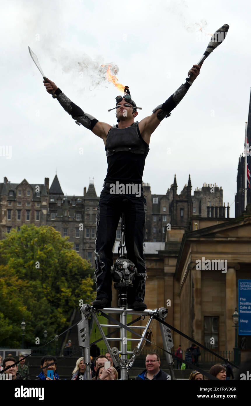 Man juggling with fire in the centre of Edinburgh, Scotland Stock Photo ...