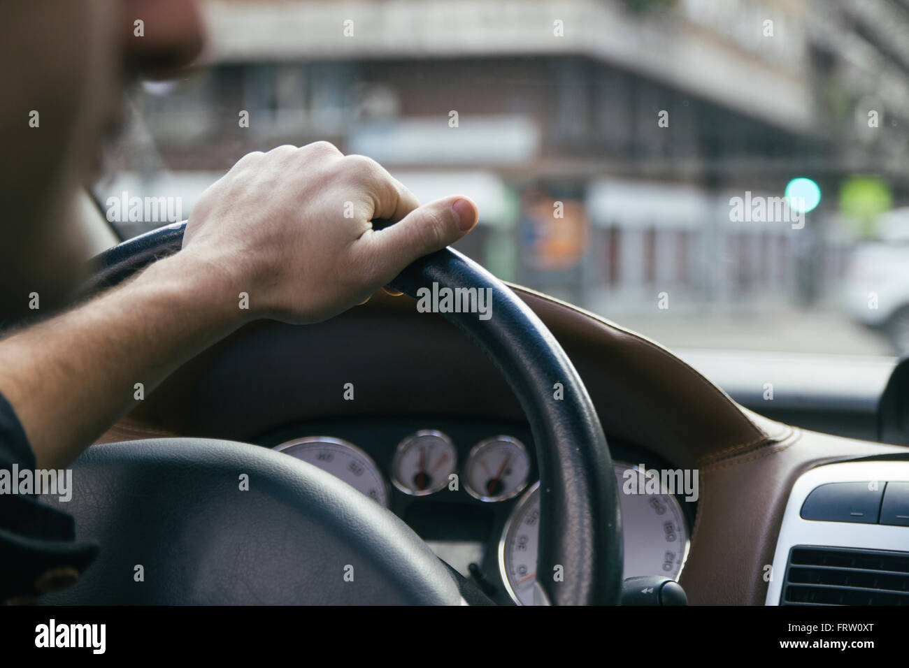 Hand of a man driving a car Stock Photo - Alamy