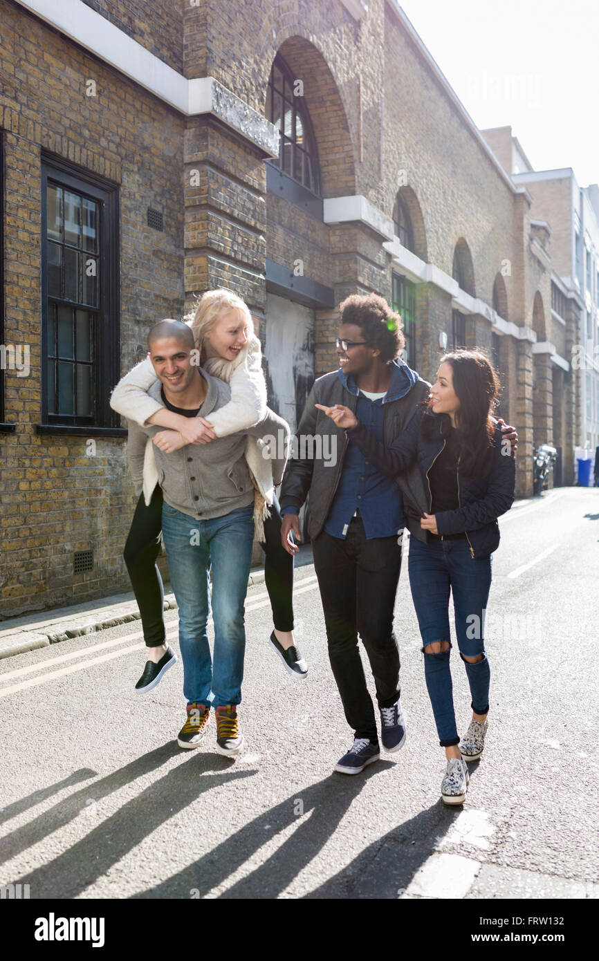 Group of friends having fun on urban street Stock Photo - Alamy