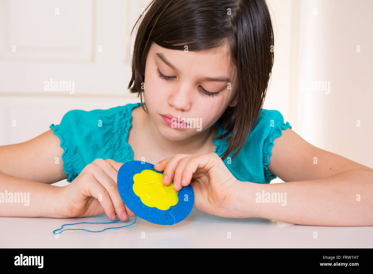 Girl embroidering hi-res stock photography and images - Alamy