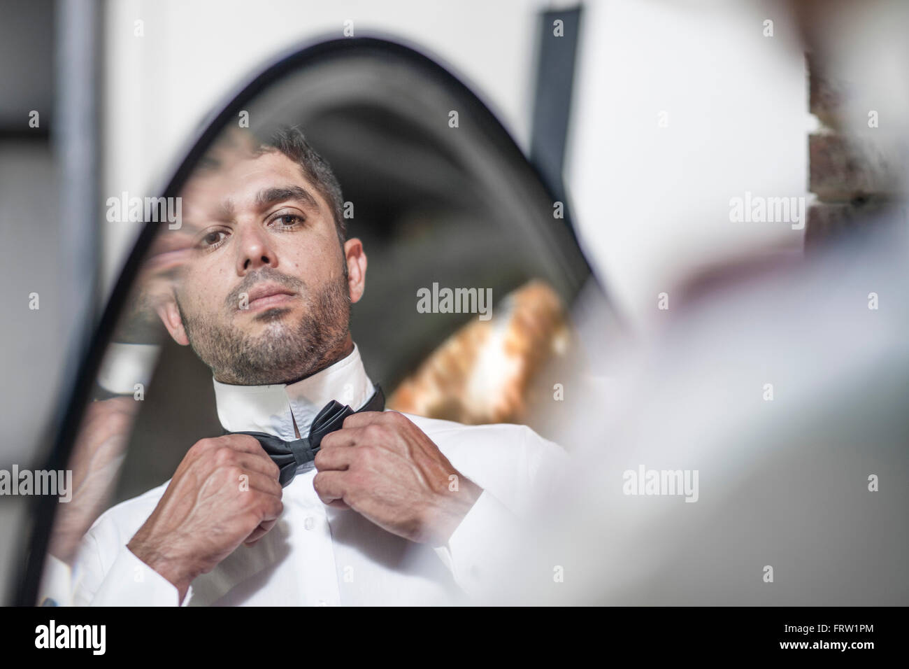 Man bowtie adjusting hi-res stock photography and images - Alamy