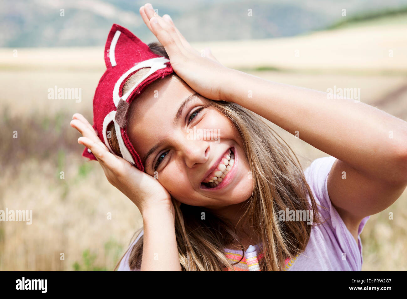 Portrait of happy girl with animal mask Stock Photo - Alamy