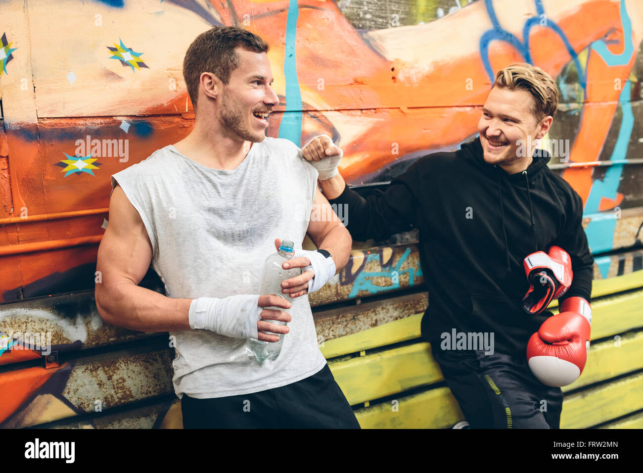 Two boxers talking after training Stock Photo - Alamy