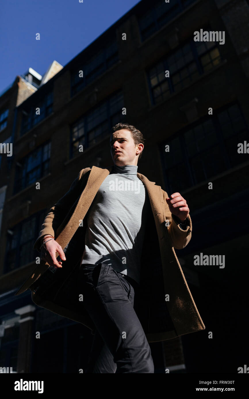 Young man in a hurry in the city Stock Photo - Alamy