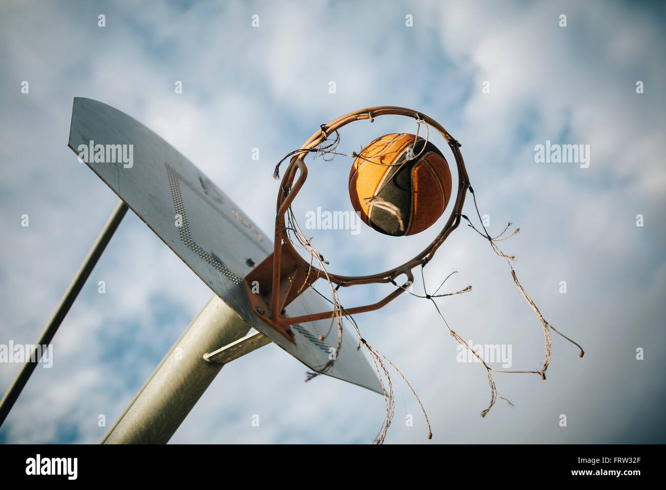 Basketball in hoop Stock Photo - Alamy