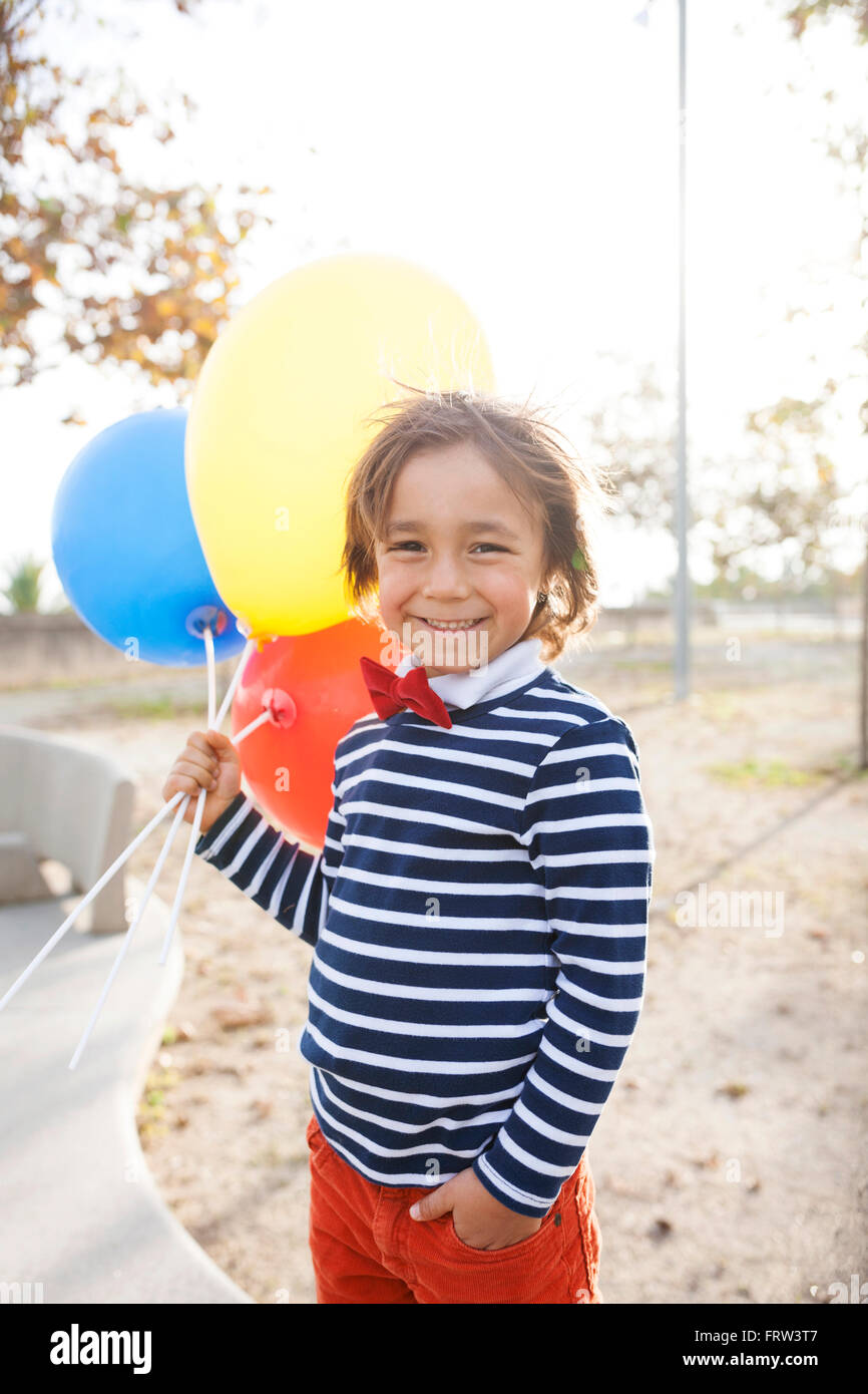 Boy balloons hi-res stock photography and images - Alamy