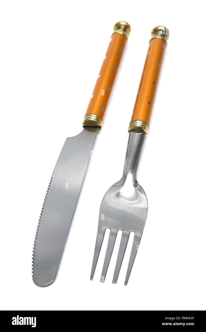Beautiful knife and fork on a white background Stock Photo - Alamy