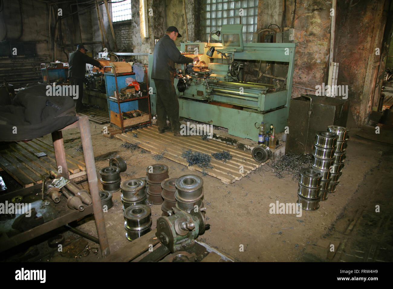 Lathe and the turner at a machine-building factory Stock Photo - Alamy