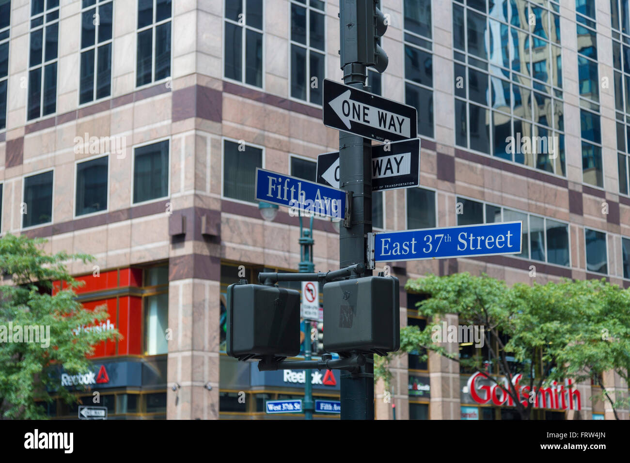 NYC signpost in Midtown Manhattan at landmark streets 5th Ave and 37th ...