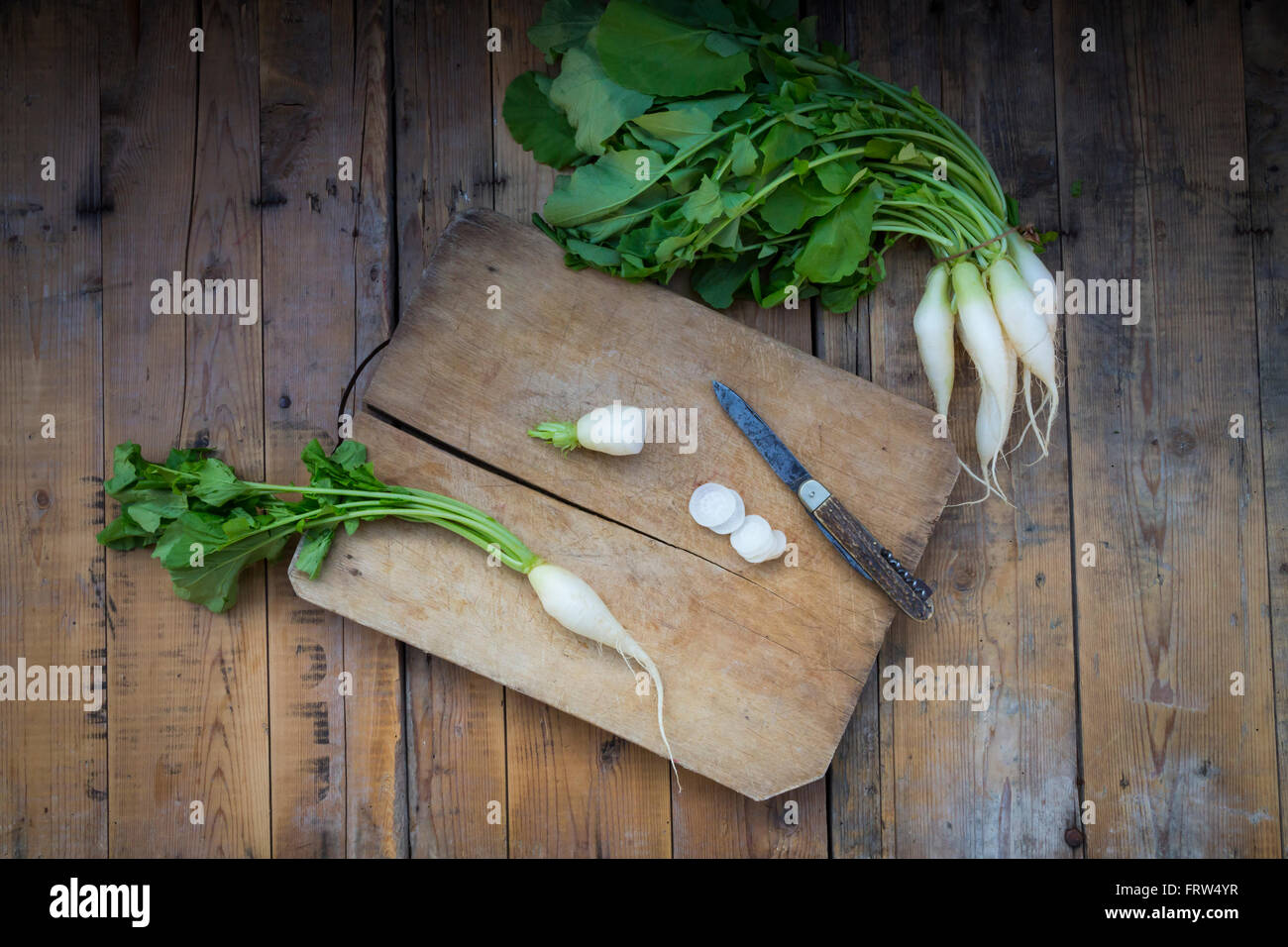 Sliced and whole white beer radish on wooden board Stock Photo - Alamy