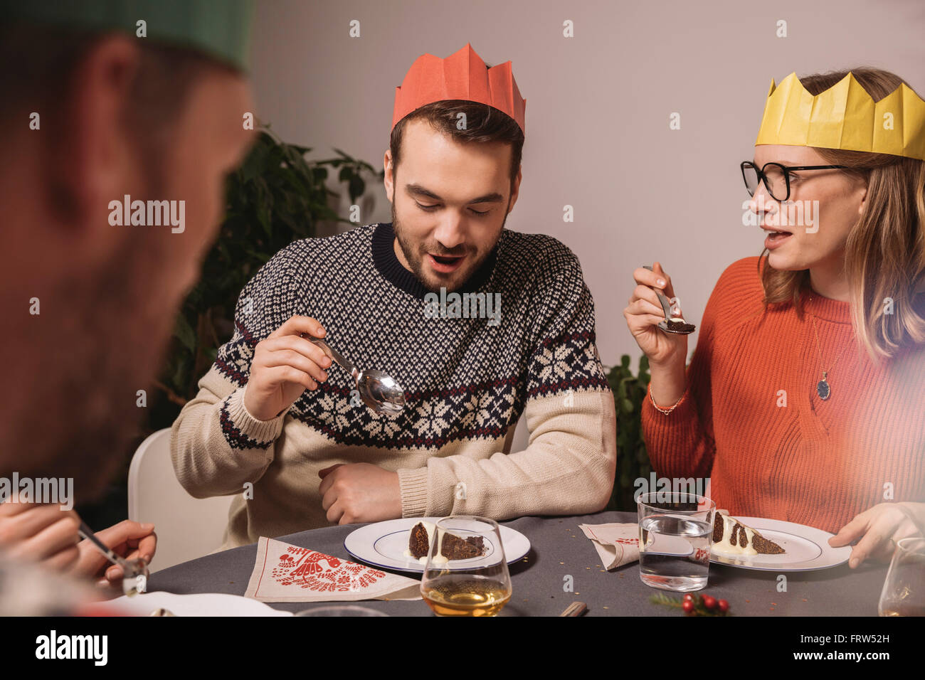 Family members talking while having Christmas pudding Stock Photo - Alamy