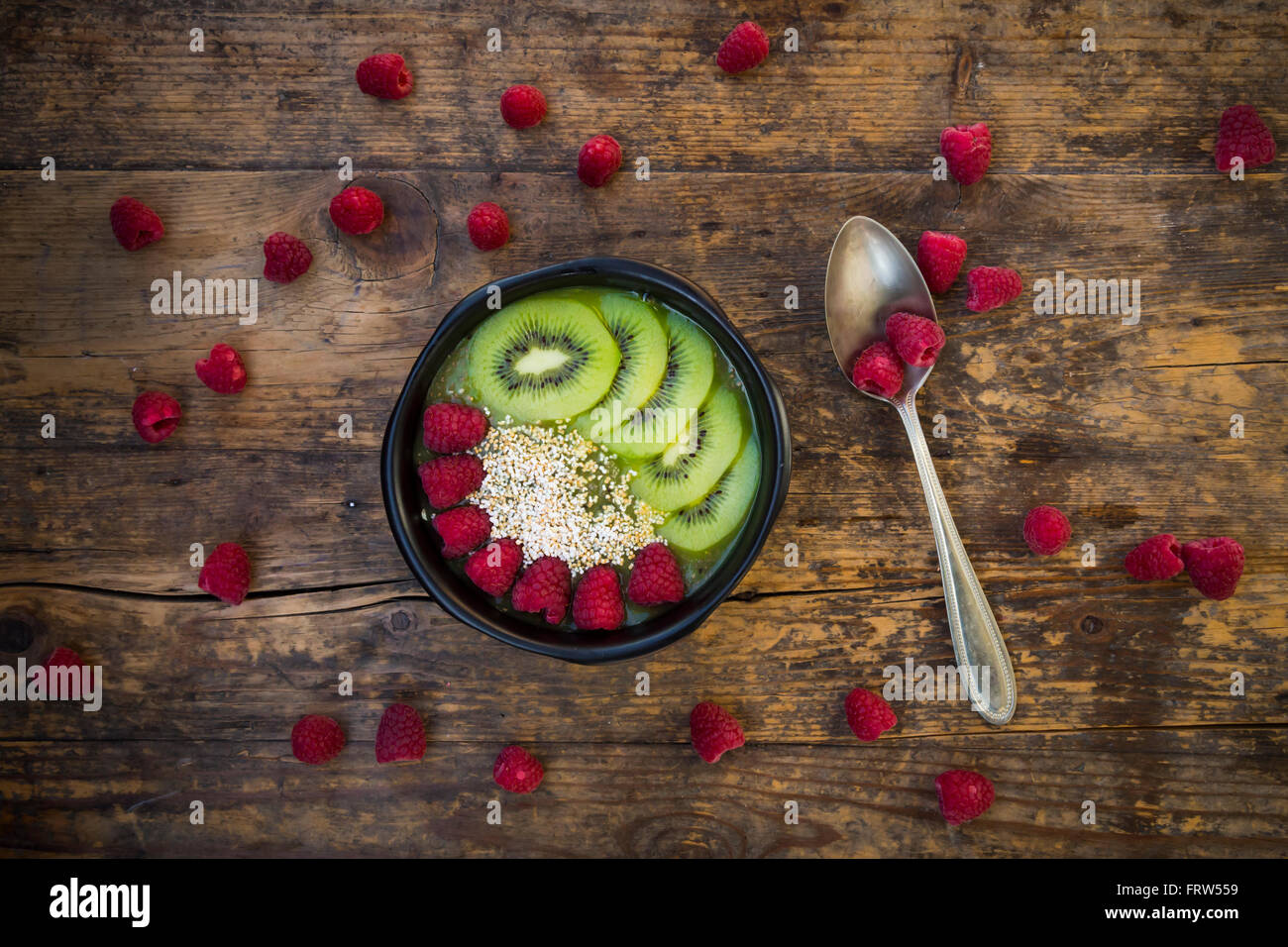 Bowl of kiwi apple rocket smoothie with chia seed, popped amarant, kiwi ...