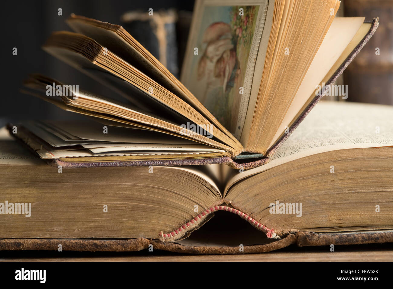 Two opened book in a historic library, close-up Stock Photo - Alamy