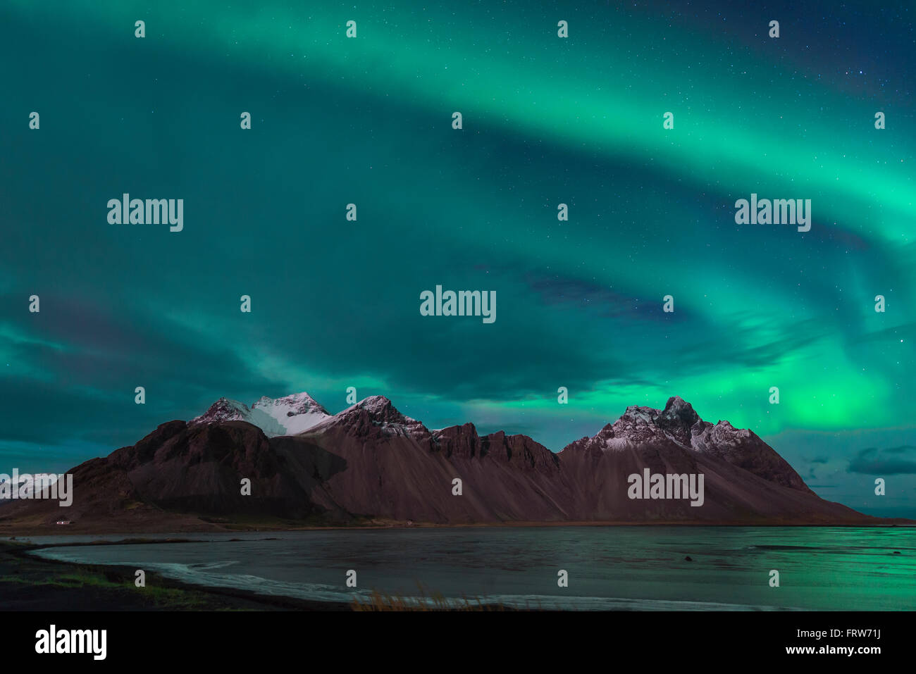 Iceland, Hoefn, Northern lights over Vesturhorn Mountains Stock Photo ...