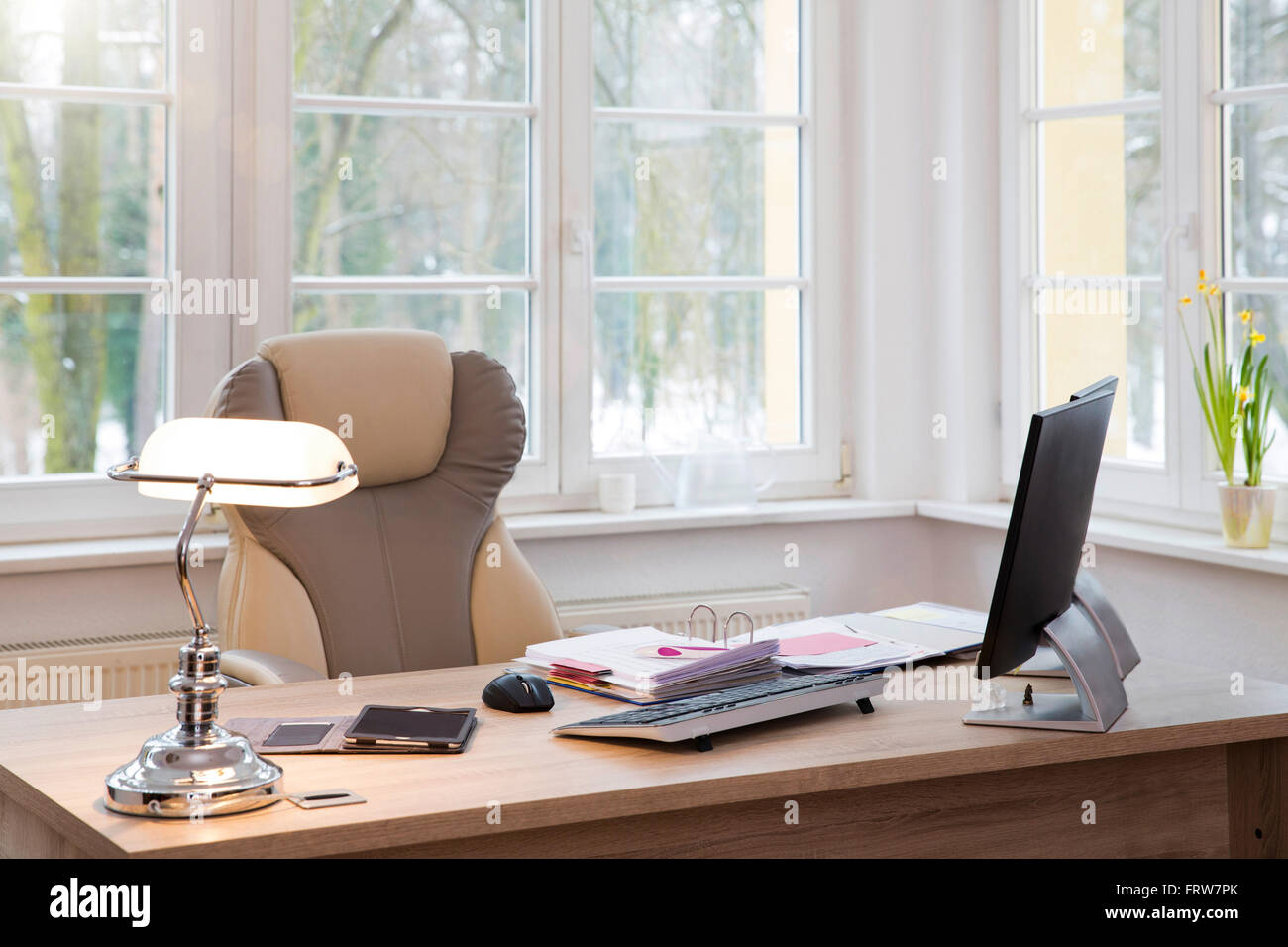 Desktop at the window in office Stock Photo - Alamy