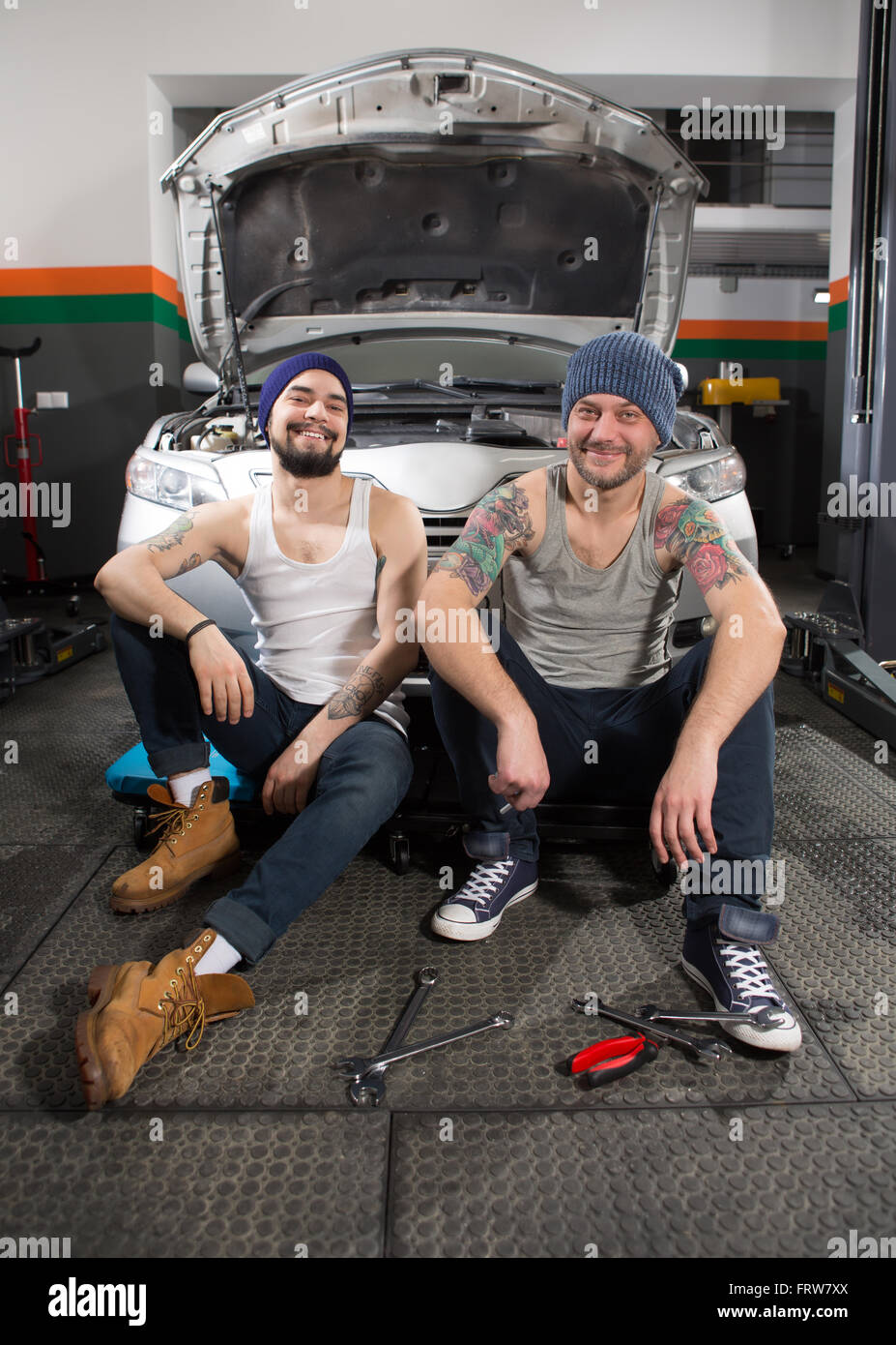 Workers at service station Stock Photo - Alamy
