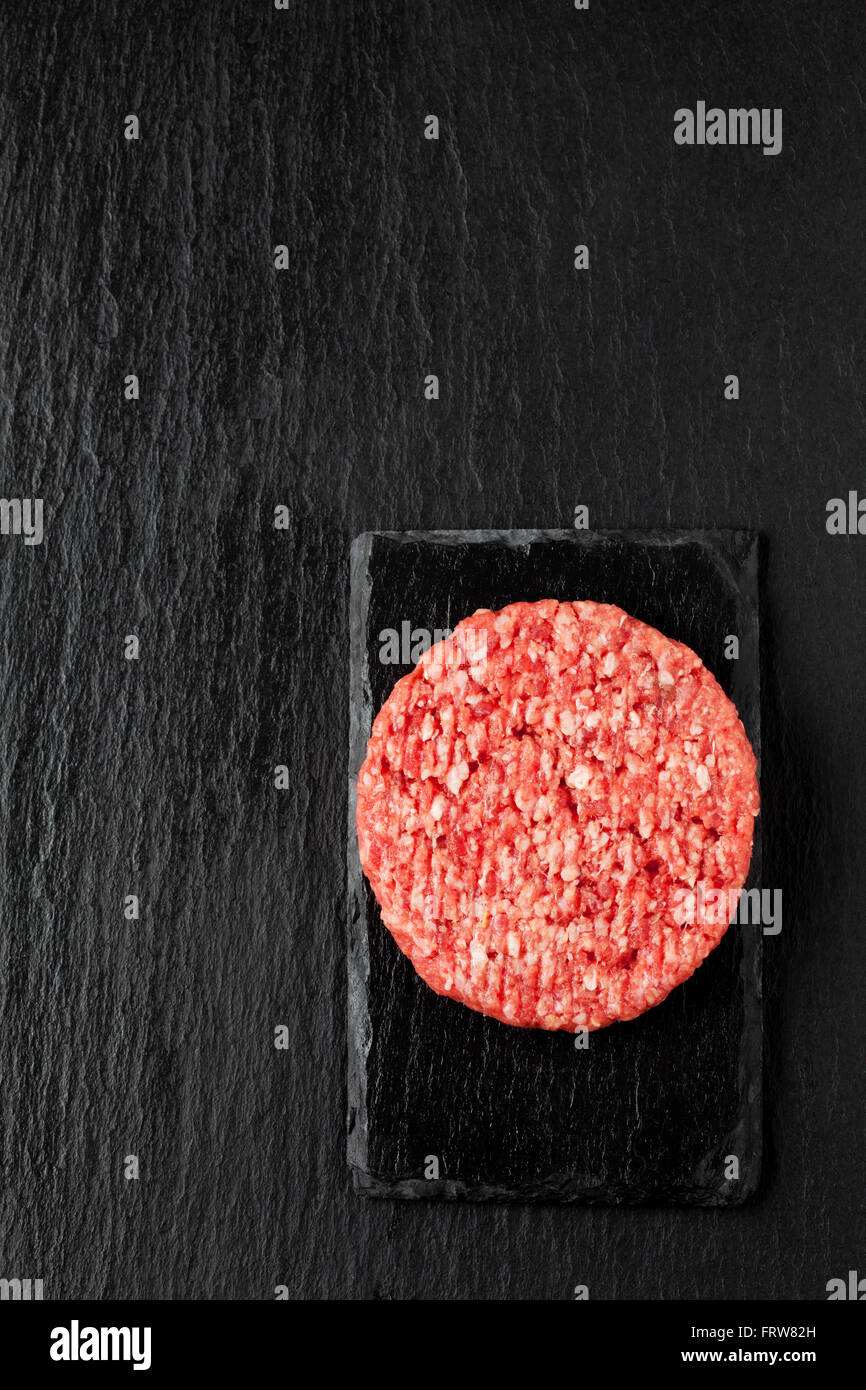 Raw beef patty Stock Photo - Alamy