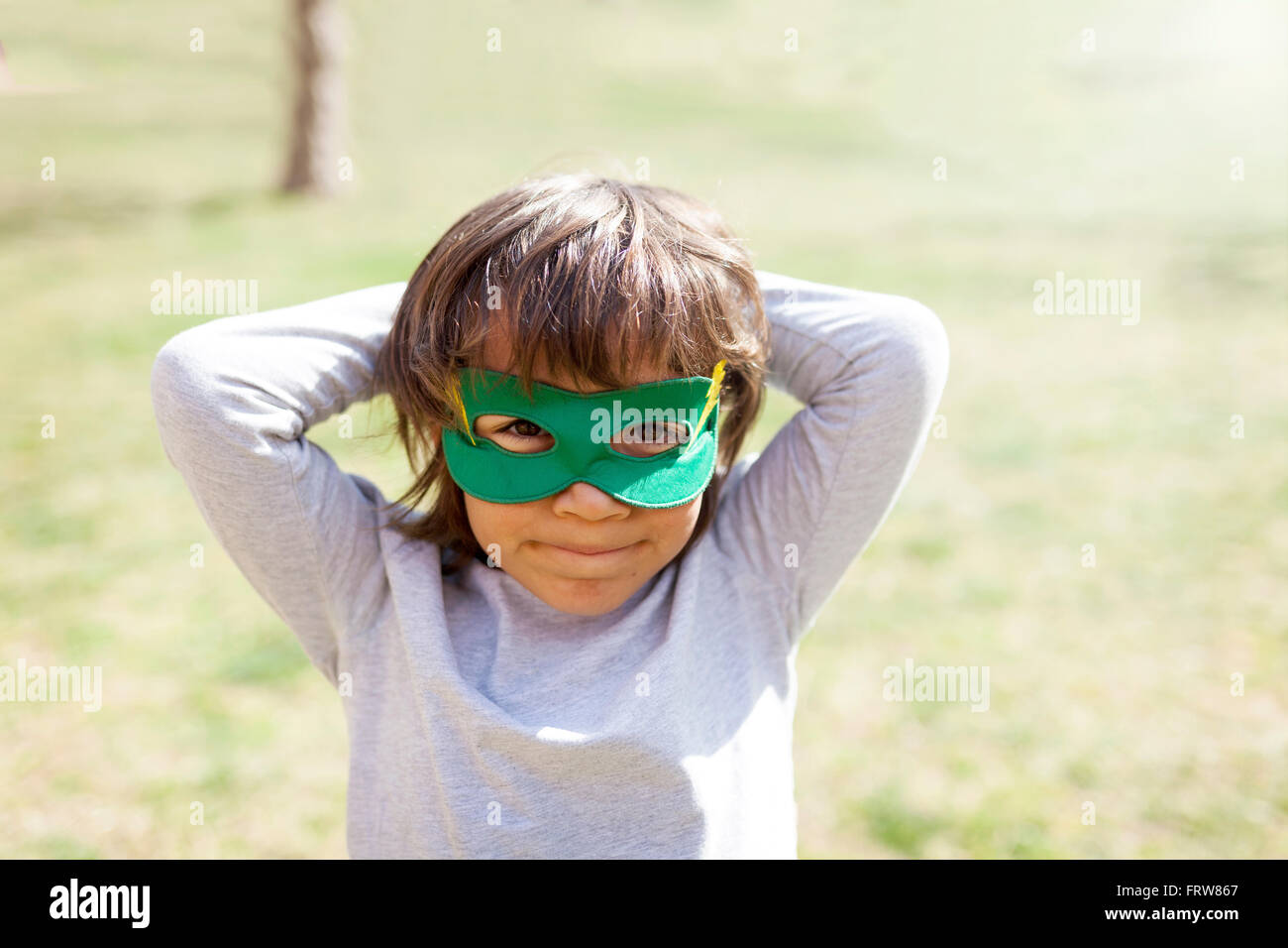 Portrait of little boy wearing green eye mask Stock Photo - Alamy
