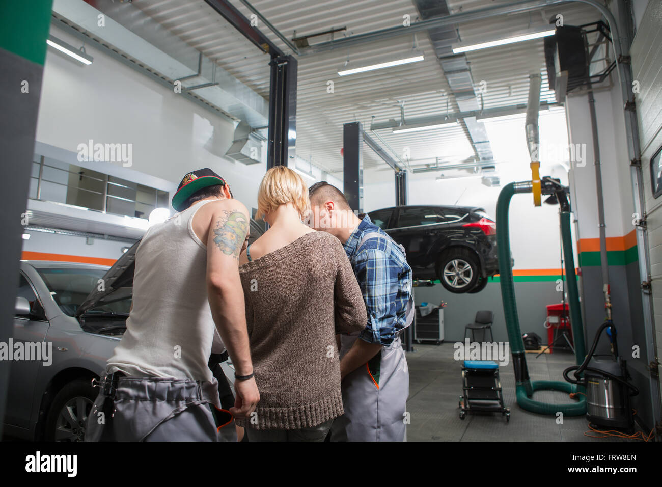 Mechanics repairing auto service station hi-res stock photography and images - Alamy