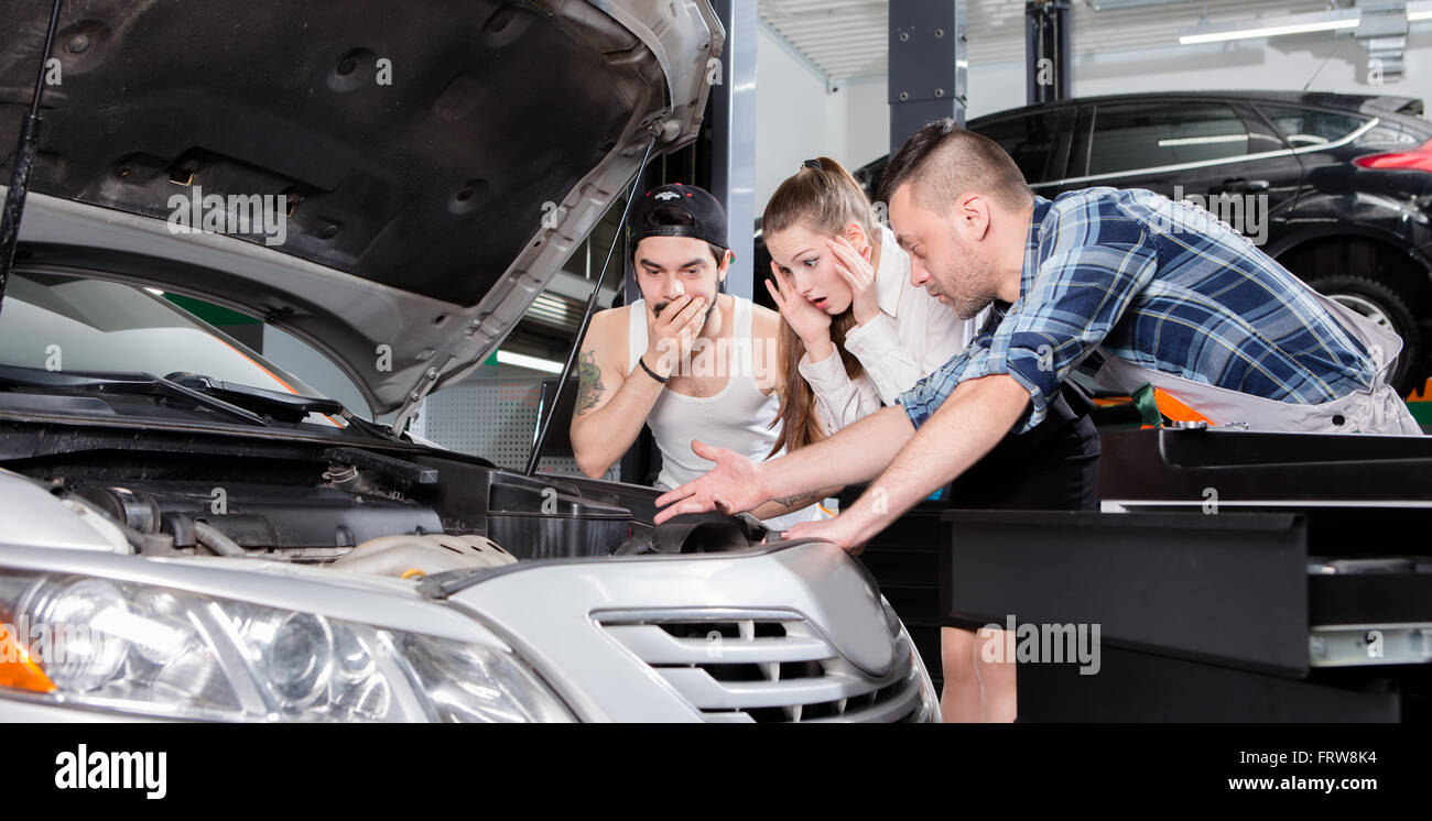Automobile service mechanics checking hi-res stock photography and ...
