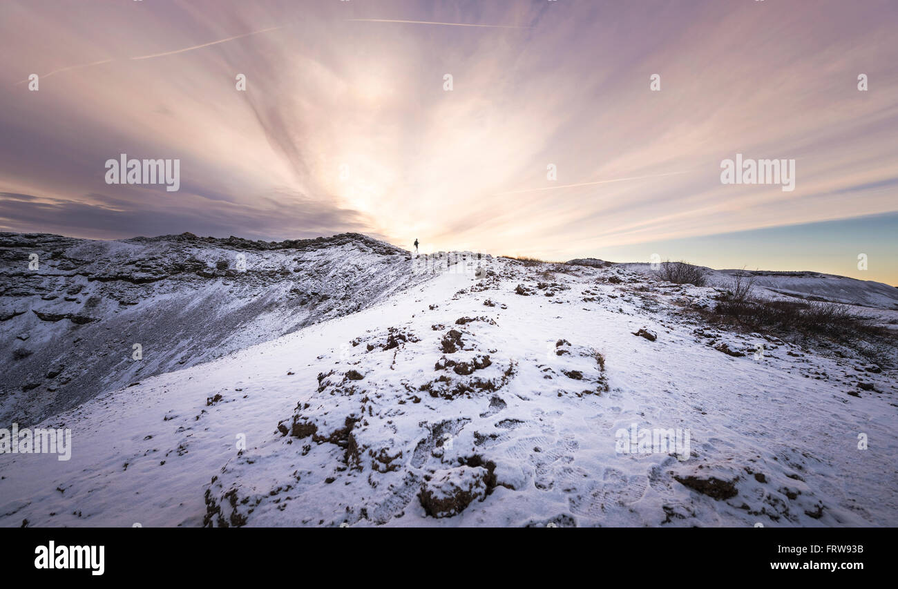 Iceland, Kerid, person walking along Volcanic crater rim at Golden ...