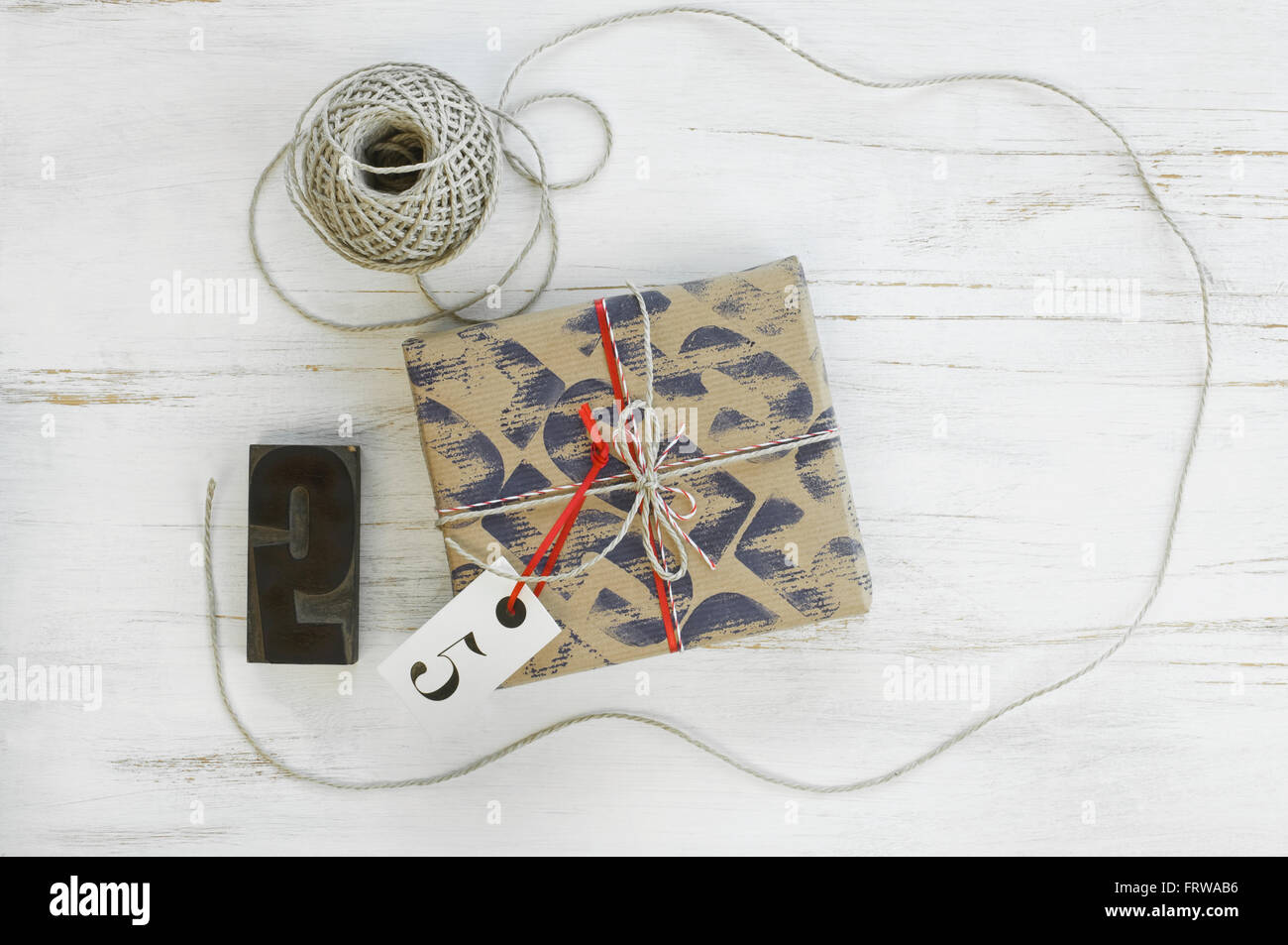 Printed packing paper, stamp, cord, packet Stock Photo - Alamy