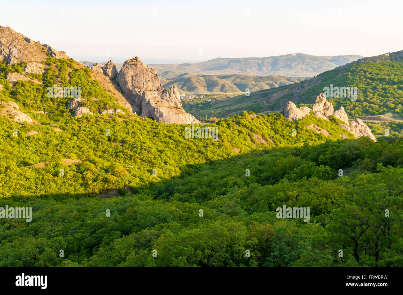 Beautiful mountains with green juniper seen at sunset near New World ...