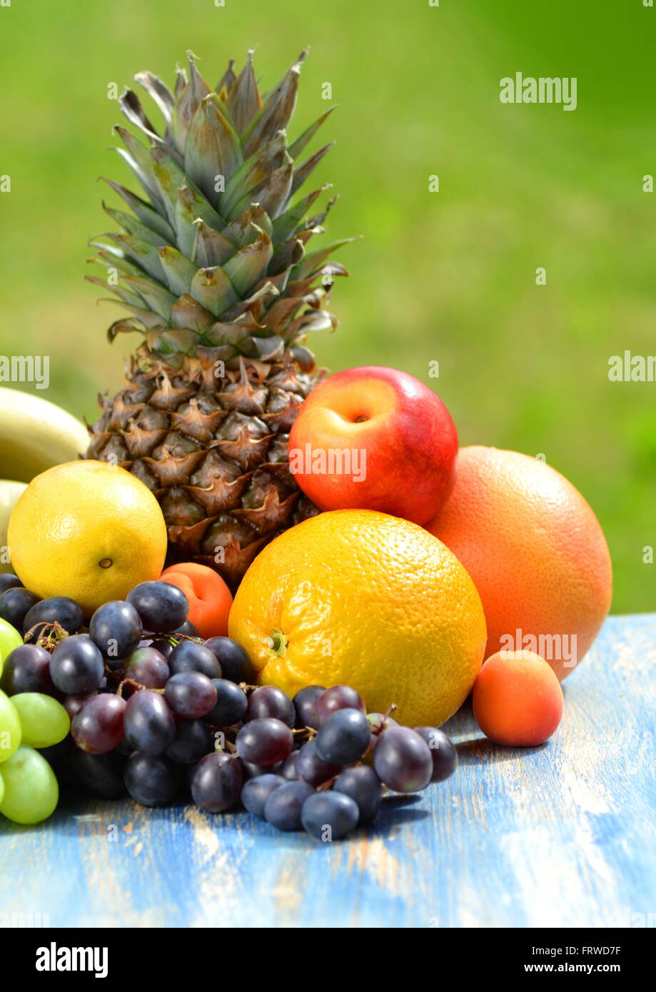 variety of fruits on table in the garden Stock Photo - Alamy