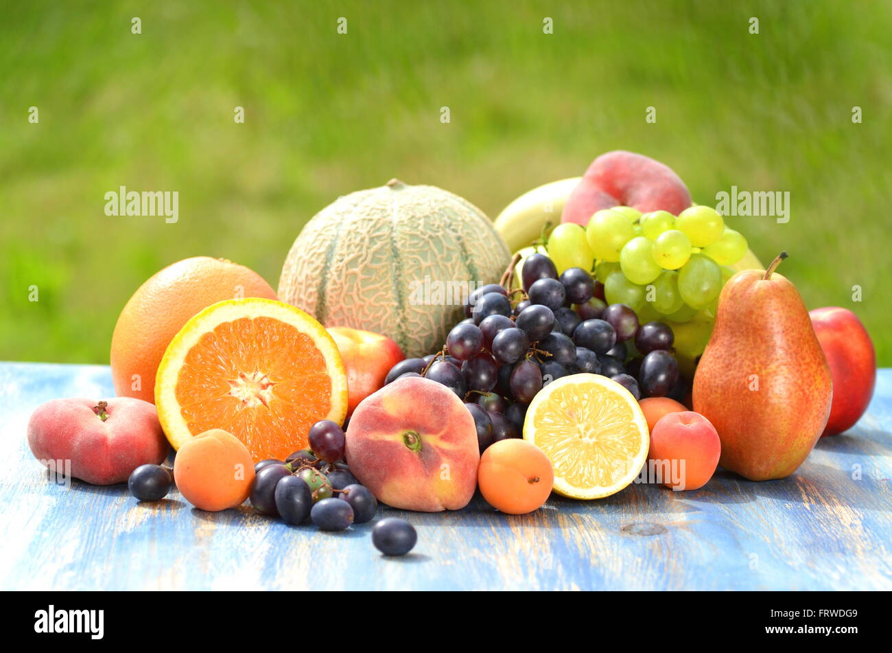 variety of fruits on table in the garden Stock Photo - Alamy