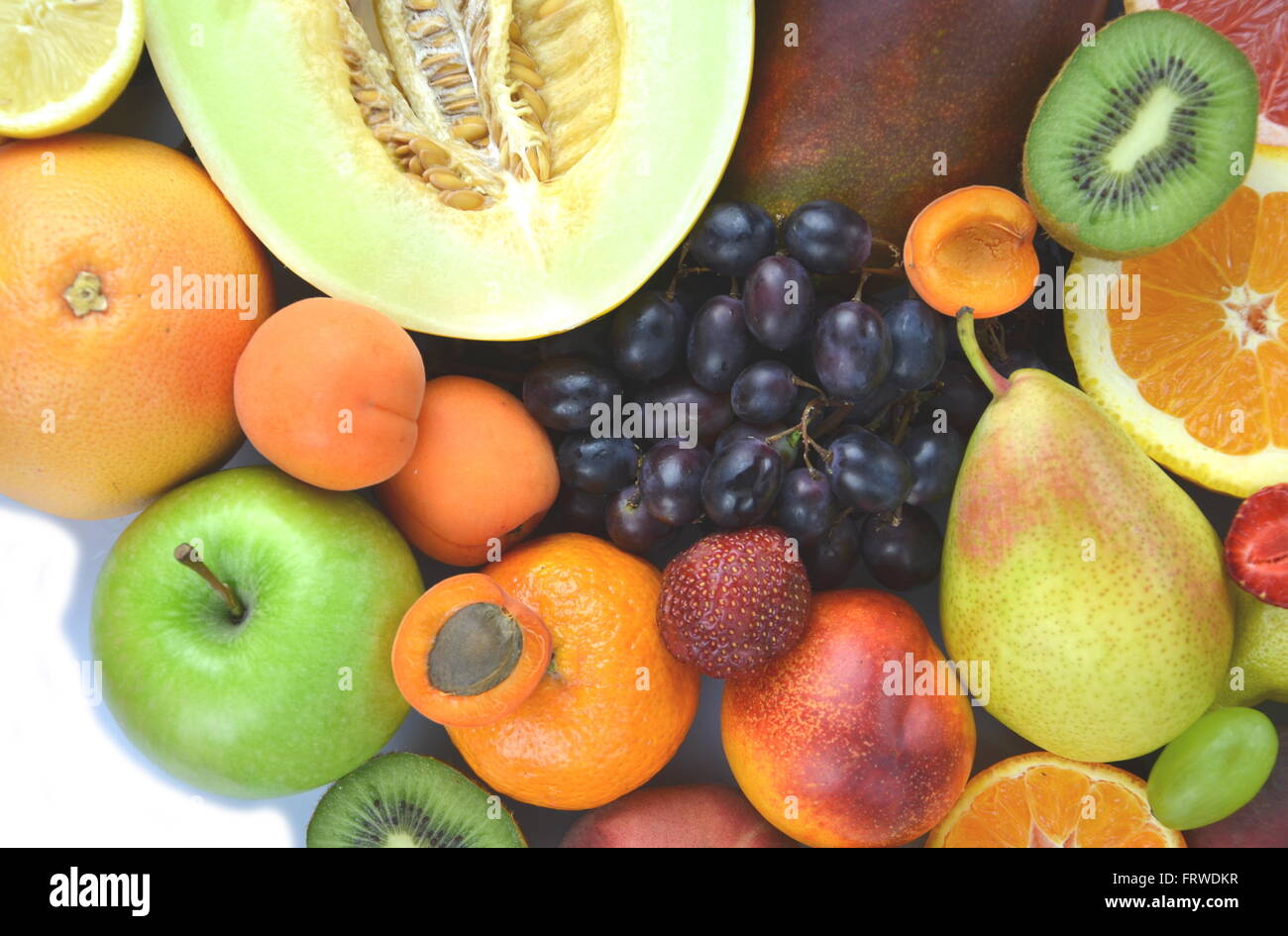 Variety of fresh and delicious fruits isolated on white Stock Photo - Alamy