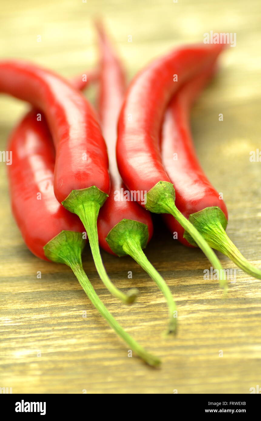 red hot chilli peppers on table Stock Photo - Alamy