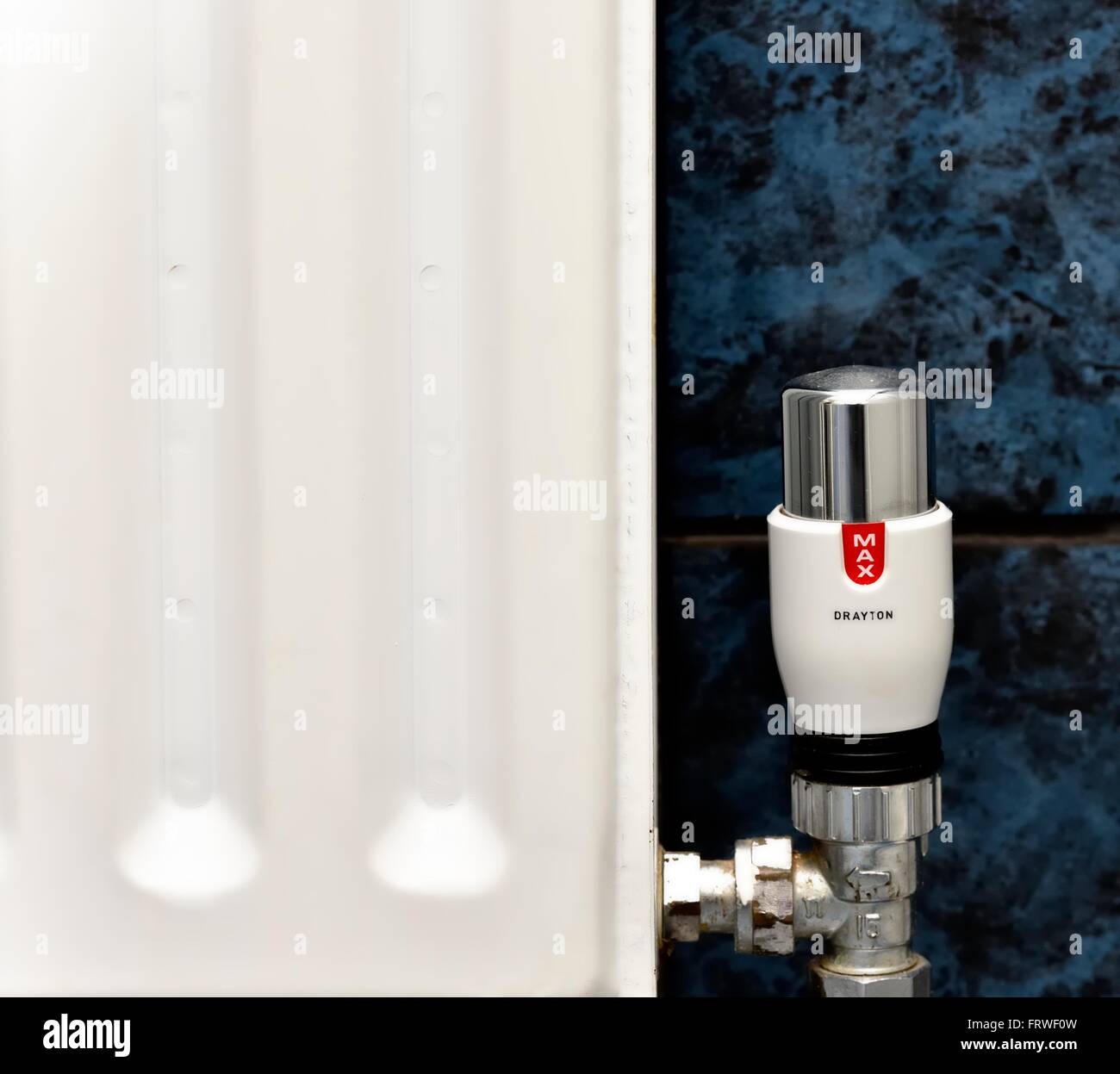 A radiator and thermostat control set to max Stock Photo - Alamy