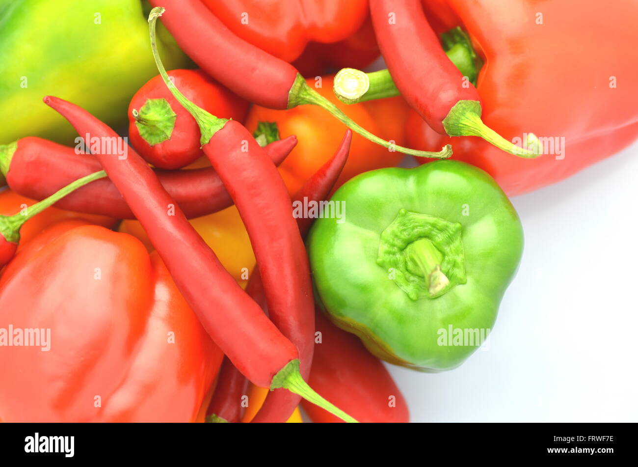 variety of raw peppers isolated on white background Stock Photo - Alamy