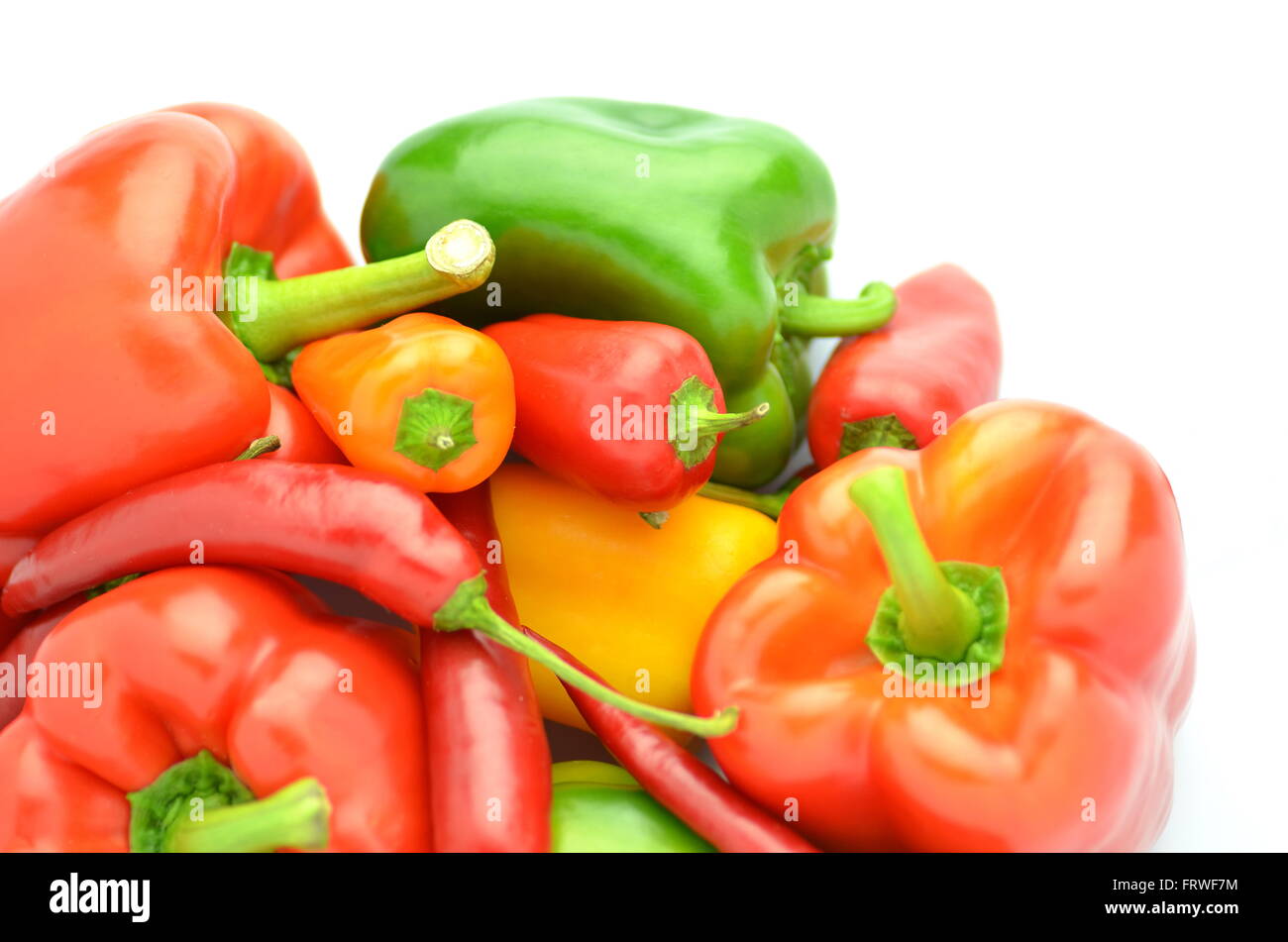 variety of raw peppers isolated on white background Stock Photo - Alamy