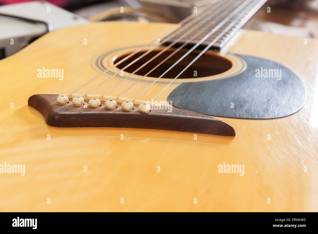 bridge acoustic guitars. six strings for background Stock Photo - Alamy