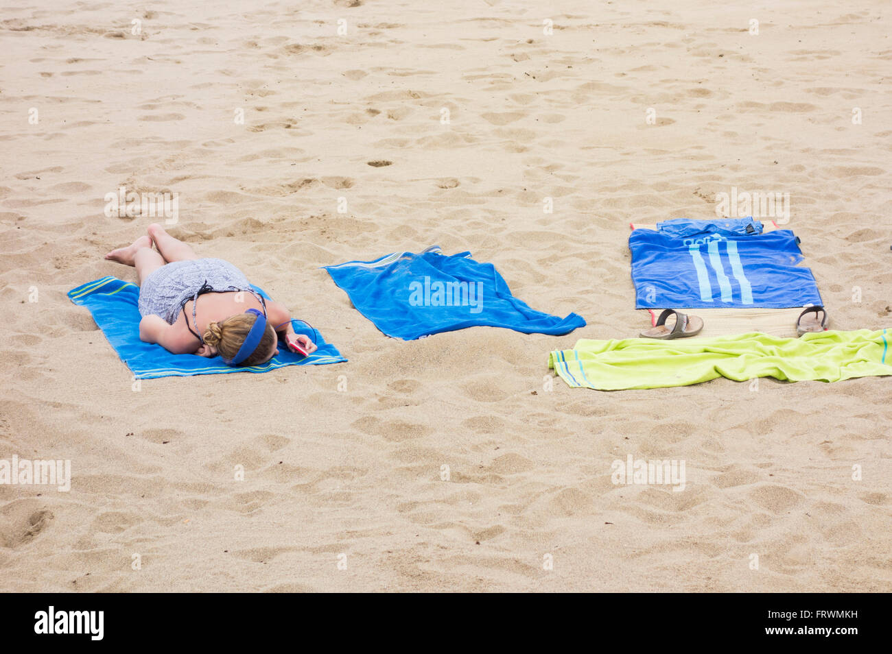 Woman beach young sunbathing hi-res stock photography and images - Alamy