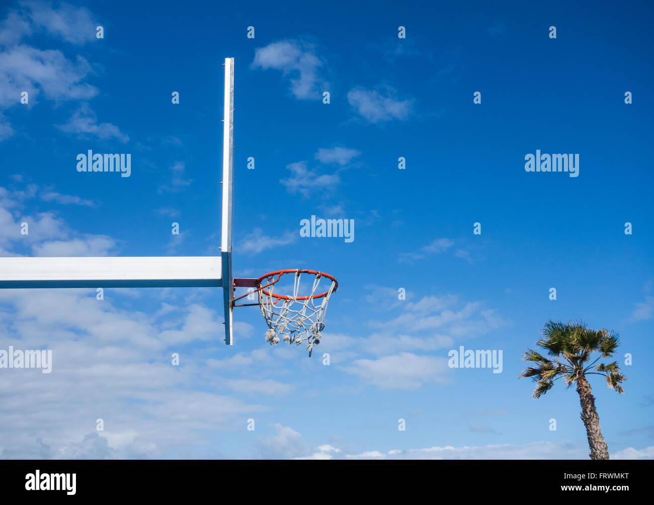Basketball hoop against blue sky Stock Photo - Alamy