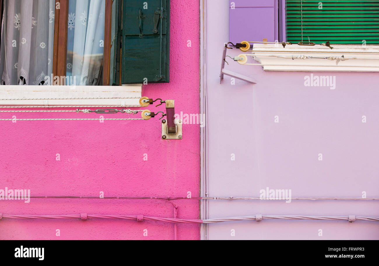Two washing line and two electric cable with colorful wall in Burano ...