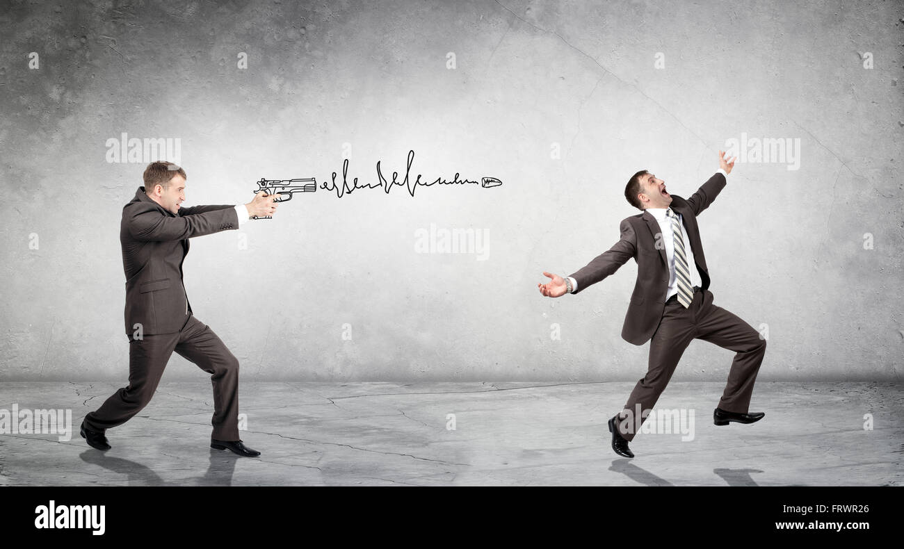 Businessman shooting another man Stock Photo - Alamy
