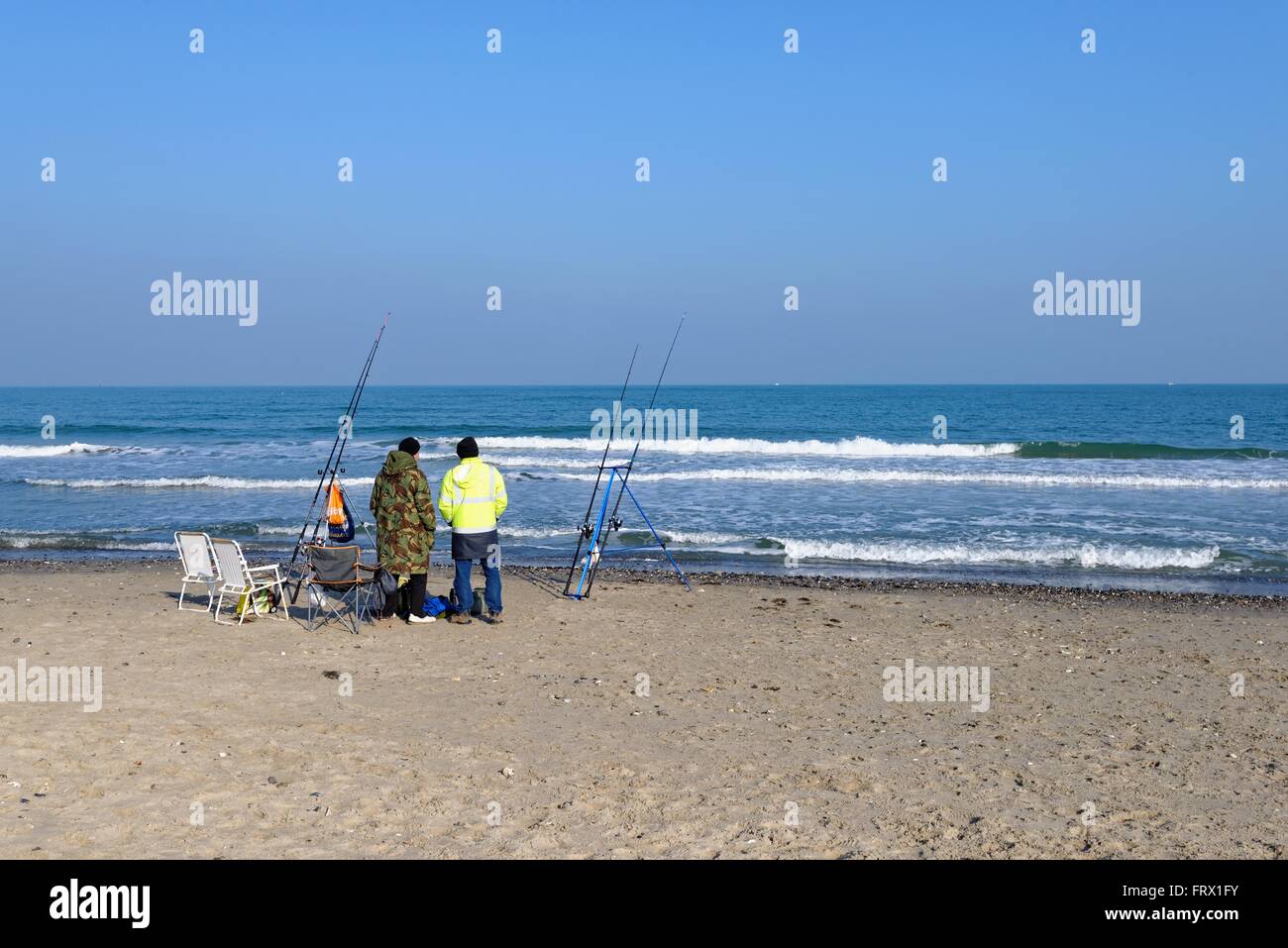 Two men beach fishing hi-res stock photography and images - Alamy