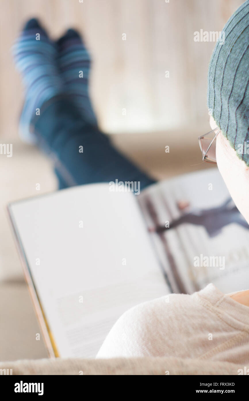 Adult reading relaxed book hi-res stock photography and images - Alamy