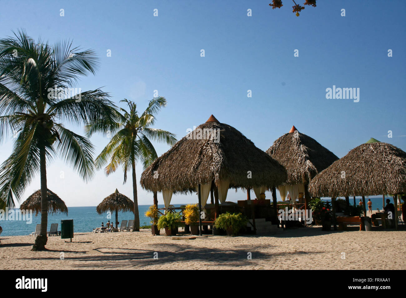 Beachside sheds or huts also called bohios or palapas at Decameron, a ...