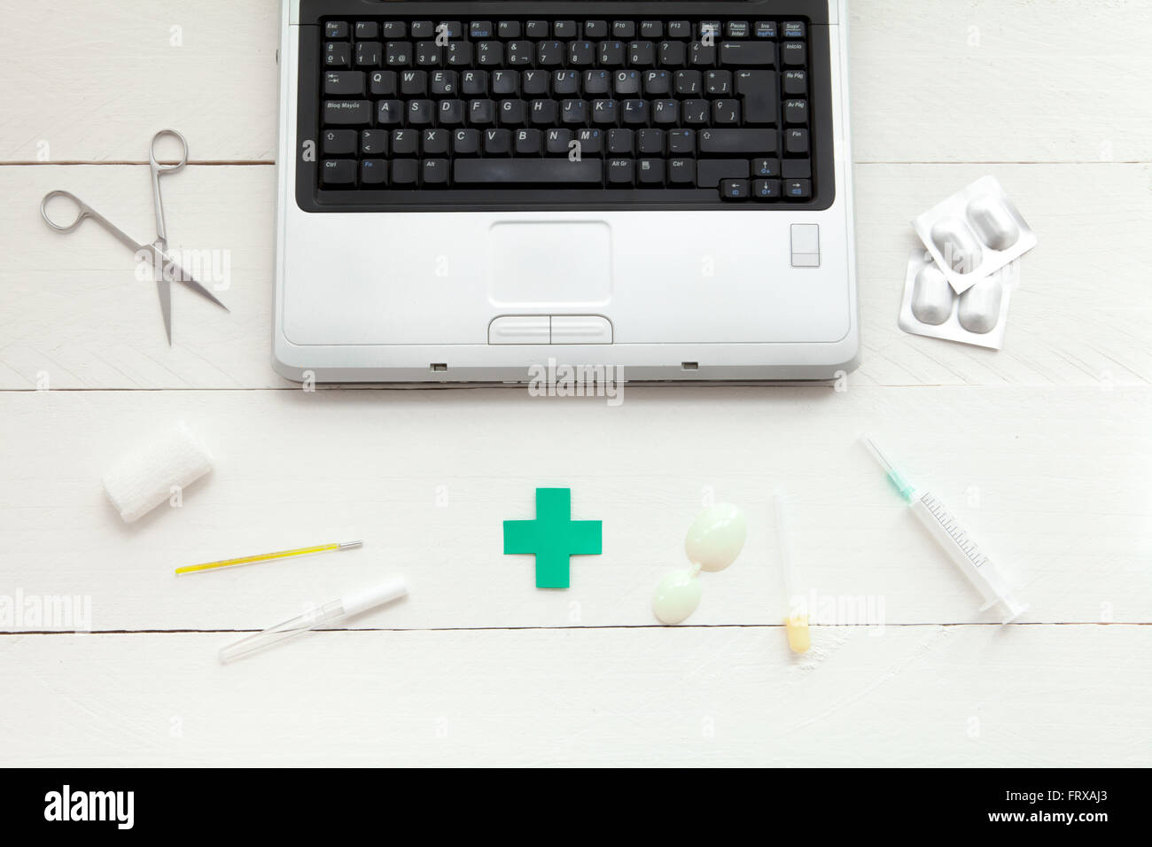 Laptop computer and retro medical instruments Stock Photo - Alamy