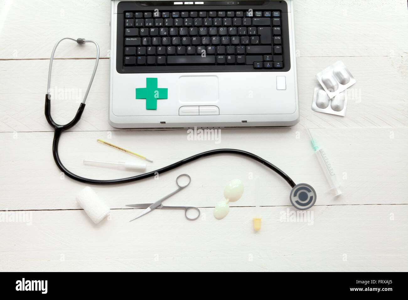 Laptop computer and retro medical instruments Stock Photo - Alamy