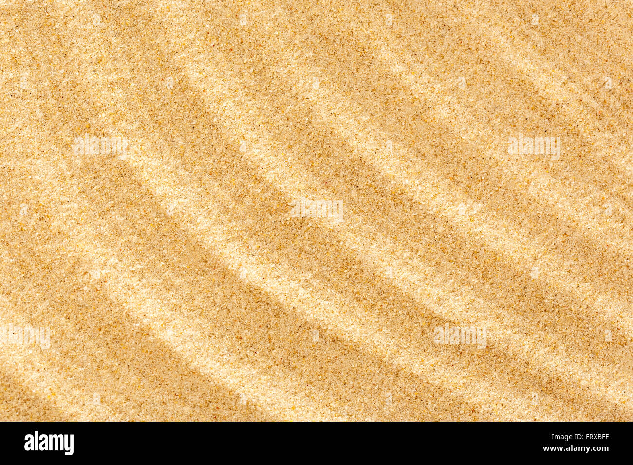 Wavy sample of beach sand as background Stock Photo - Alamy