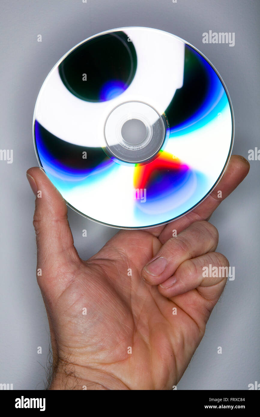 Hand holding up dvd cd hi-res stock photography and images - Alamy
