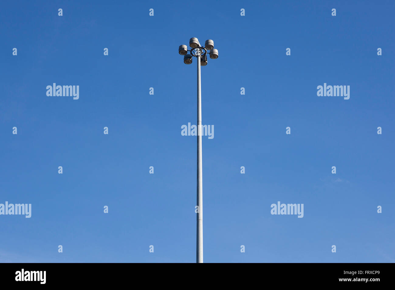 A tall lamp post stands out against a deep blue sky in the UK Stock ...