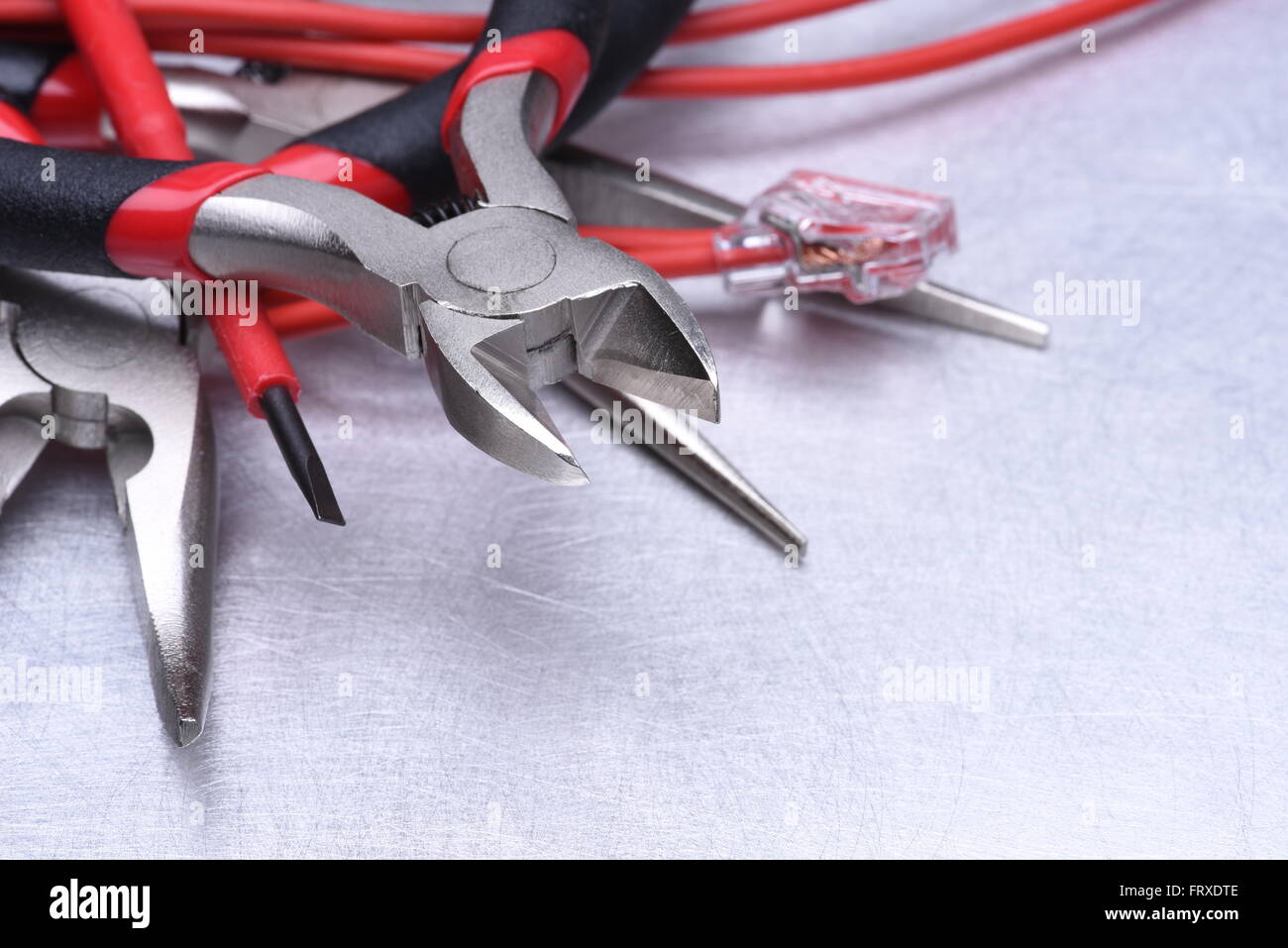 Tools for electrician and cables on grey metal surface Stock Photo - Alamy